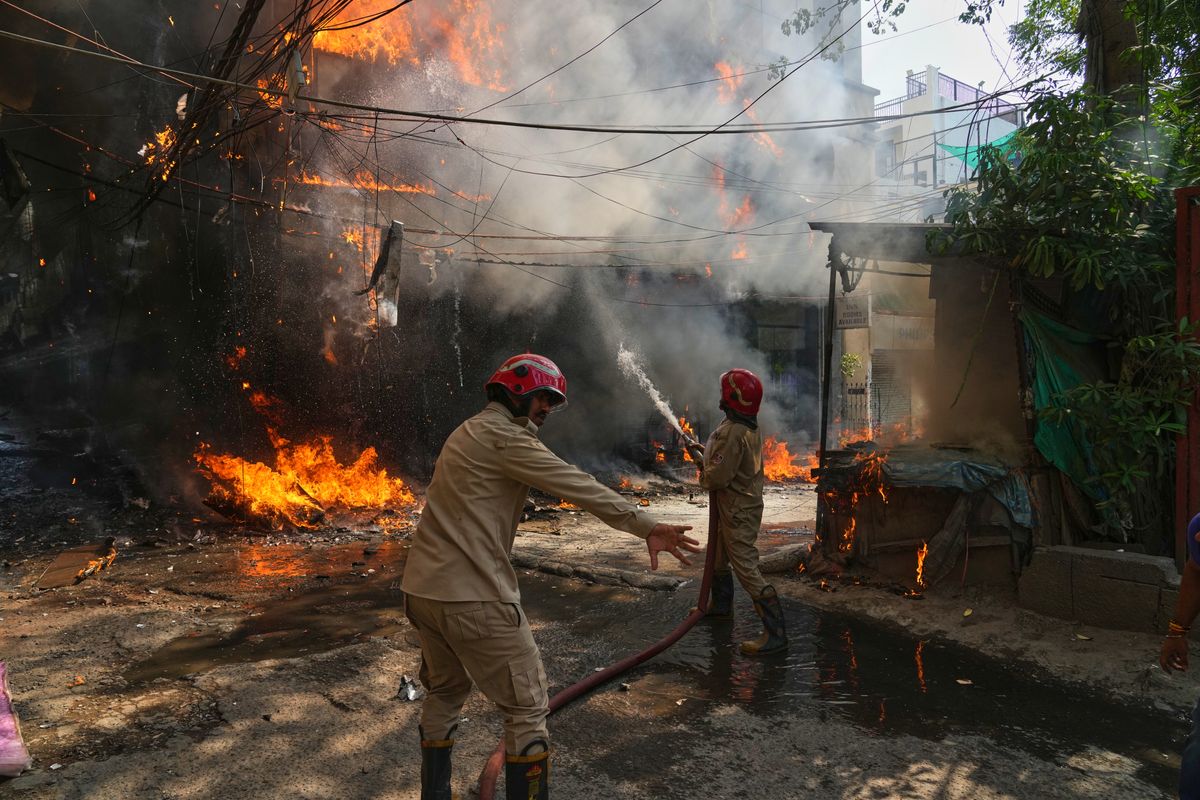 Fire sweeps through a New Delhi building, killing at least 21 people ...