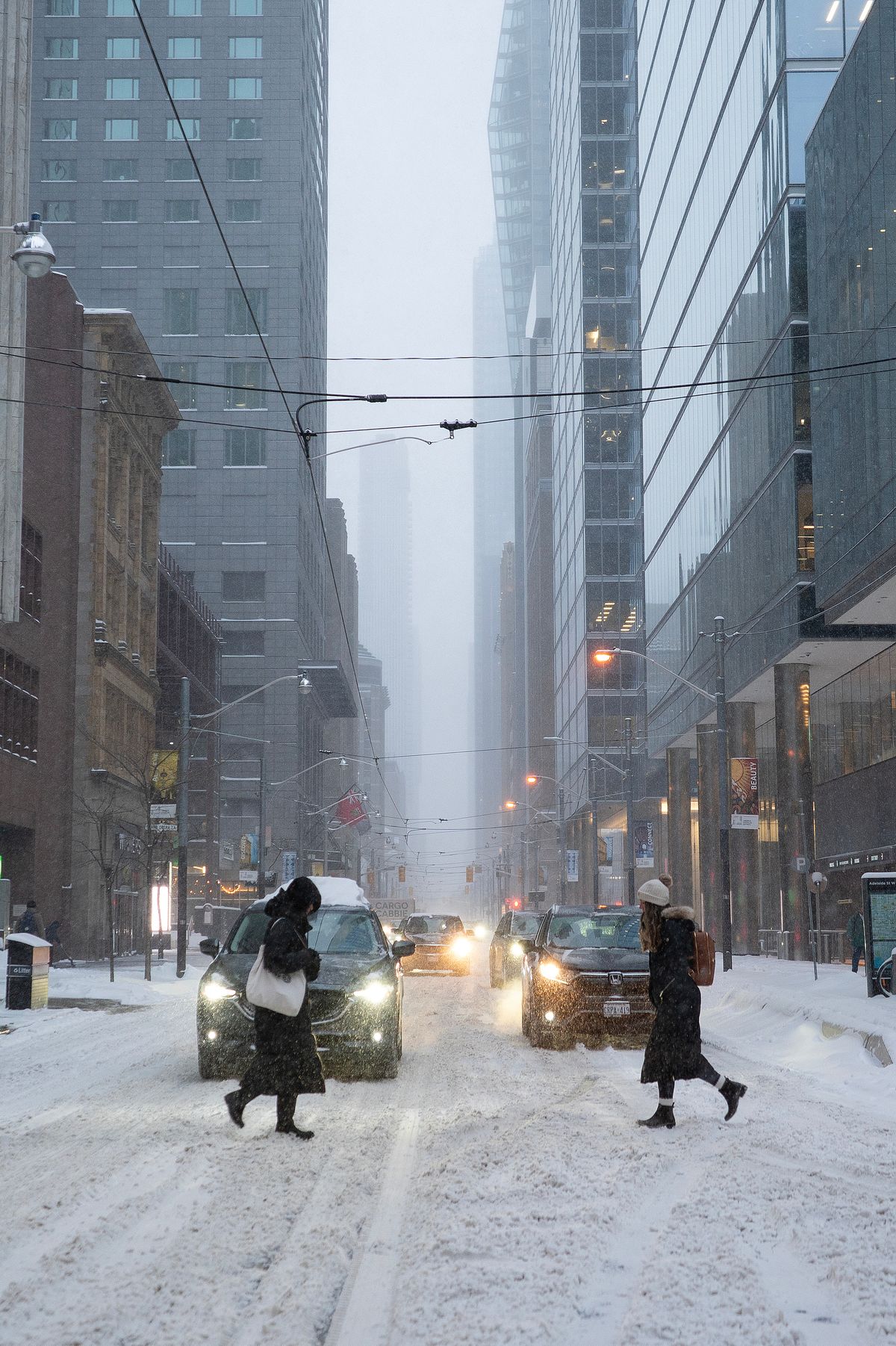Toronto schools closed and commuters face delays as heavy snow blankets ...